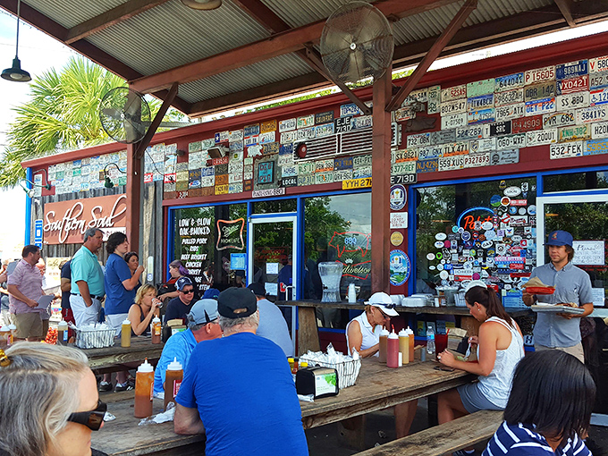 Outdoor dining where the license plates tell stories of pilgrimages past. Everyone here is either having a religious experience or about to. 