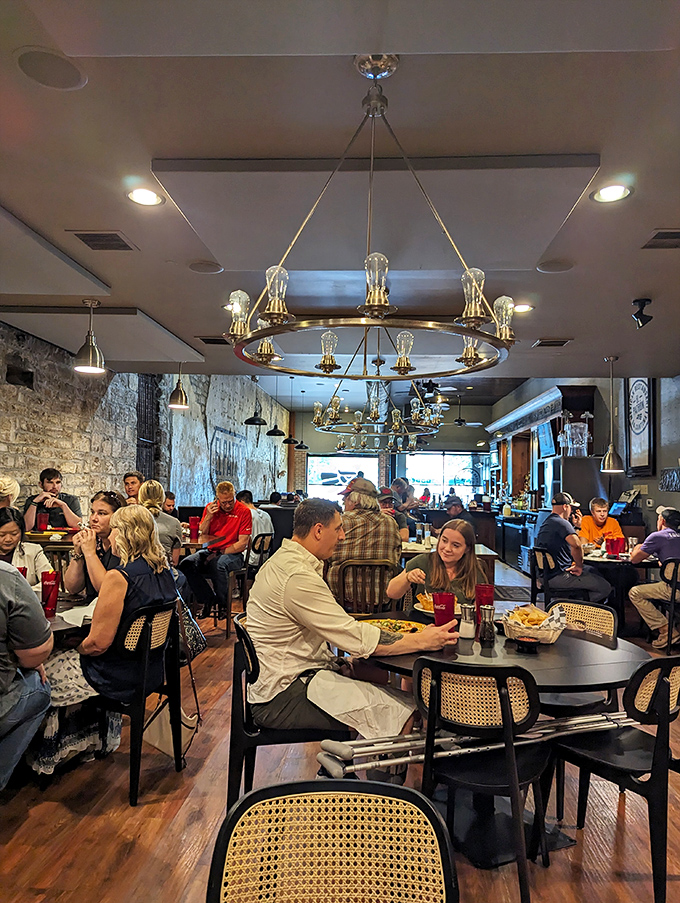 When a restaurant is this packed, you know you've struck culinary gold. Chandeliers cast a warm glow over tables where memories are made between bites.