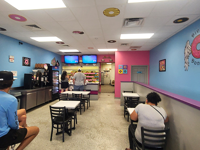 The universal language of donut appreciation brings people together in this colorful space. Notice the focused expressions&mdash;that's donut contemplation at its finest.