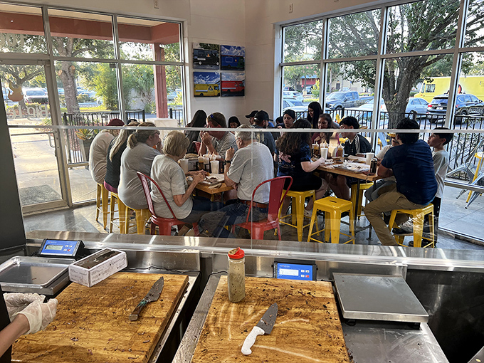 Where strangers become friends over a shared appreciation for perfectly smoked meats and sides worth fighting over.