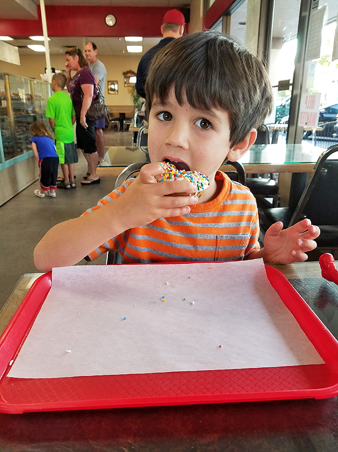 The face of pure donut joy&mdash;a moment of sprinkle-topped bliss that reminds us why childhood memories taste so sweet.