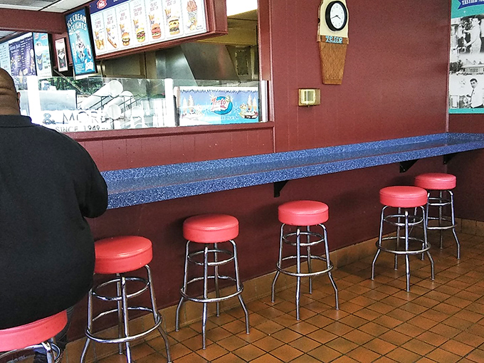 Counter seating: where solo diners become regulars and staff remembers your order. These red stools have supported generations of hungry Atlantans.
