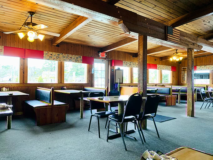 The dining room waits for the dinner rush, wooden beams and booths creating the perfect setting for the meat-centric memories about to be made.