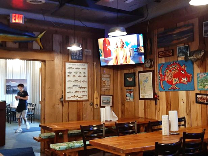 Wood-paneled walls adorned with fish charts and nautical art create an authentic seaside vibe. Somewhere, a lighthouse keeper is feeling jealous.