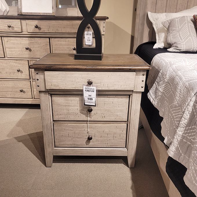 This distressed nightstand tells a story of rustic charm while secretly providing ample storage for your midnight snack stash.