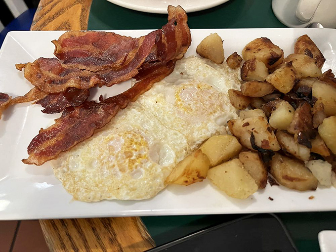 Breakfast knows no cultural boundaries &ndash; eggs, bacon, and potatoes speaking the universal language of morning comfort with Greek hospitality.