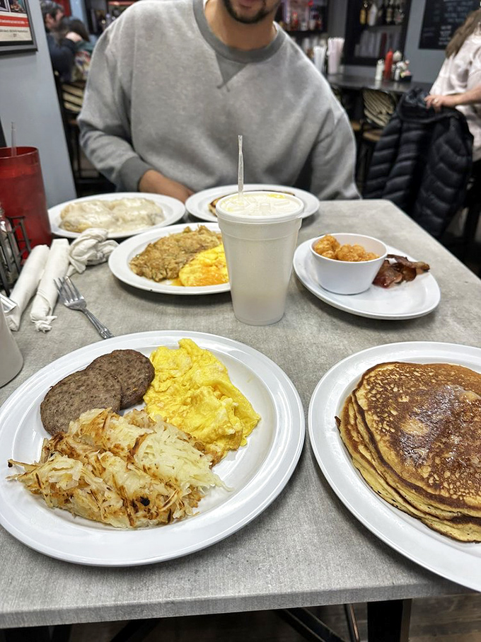 Breakfast alchemy: eggs, sausage, and those hash browns that haunt your dreams. The holy trinity of morning satisfaction. 