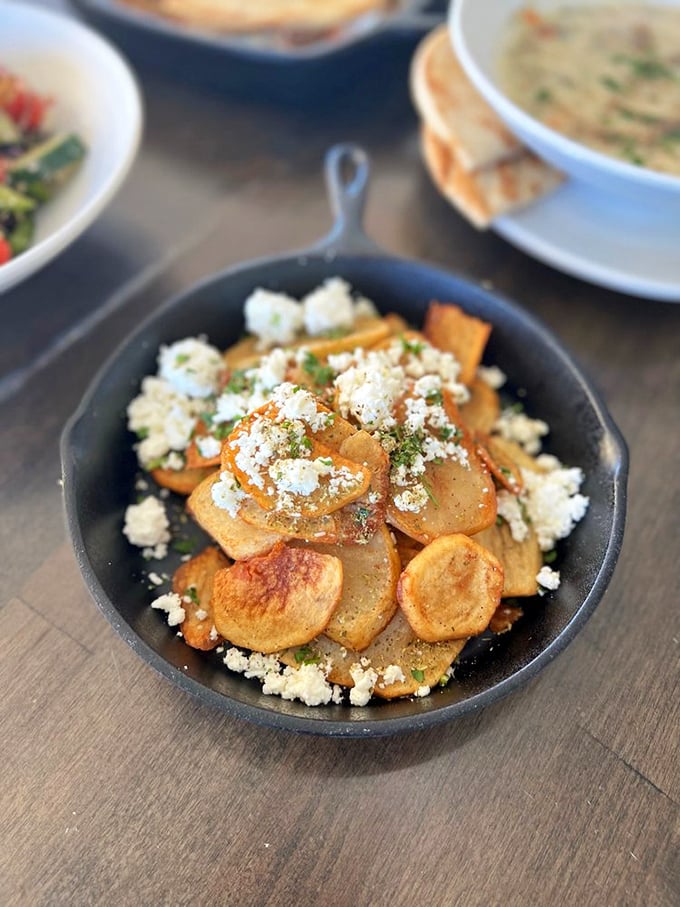 These golden potatoes topped with crumbled feta aren't just a side dish&mdash;they're what French fries dream of becoming when they grow up.