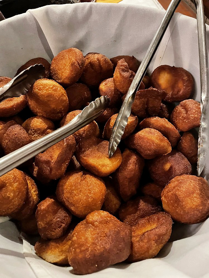 These aren't just fried biscuits; they're little pillows of happiness waiting to be dipped in something sweet or savory.