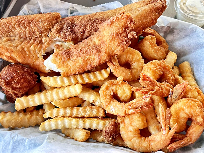 The holy trinity of seafood happiness: golden-fried fish, crispy fries, and perfectly fried shrimp. Diet starts tomorrow, promises were made to this basket.
