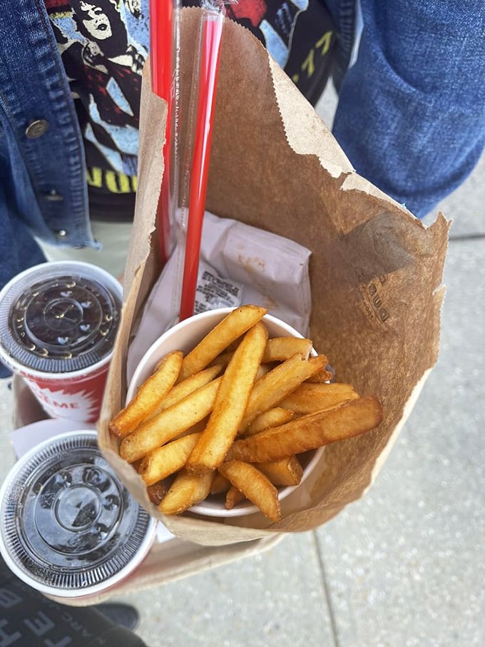 These fries in their paper nest aren't just sides&mdash;they're supporting actors deserving of their own award category. Crispy outside, fluffy inside, completely addictive.