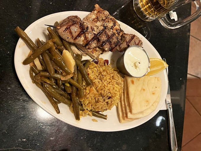 The Grecian Mixed Grill&mdash;where perfectly seasoned meat meets the company of rice and green beans. A trio that performs in perfect harmony.