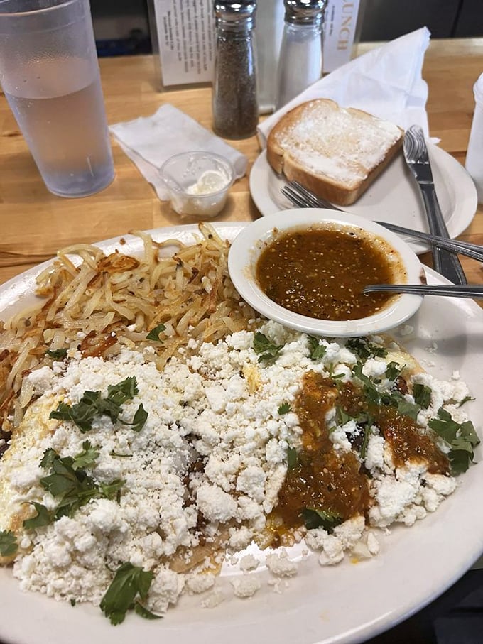 Huevos rancheros with enough cotija cheese to make you wonder if you've died and gone to breakfast heaven. The cilantro adds that perfect fresh finish.