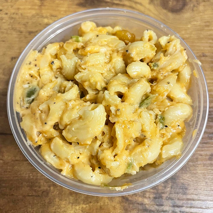 Mac and cheese that refuses to be a mere side dish. This creamy, speckled masterpiece demands equal billing with whatever meat it accompanies.