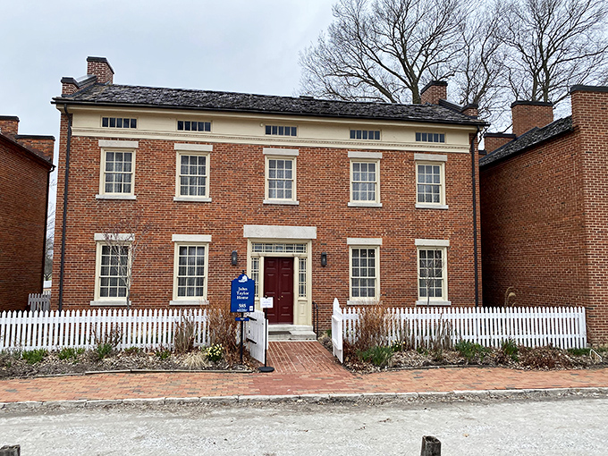History doesn't always need neon signs. This stately brick home with its symmetrical windows and crisp white trim speaks volumes about 19th-century craftsmanship.