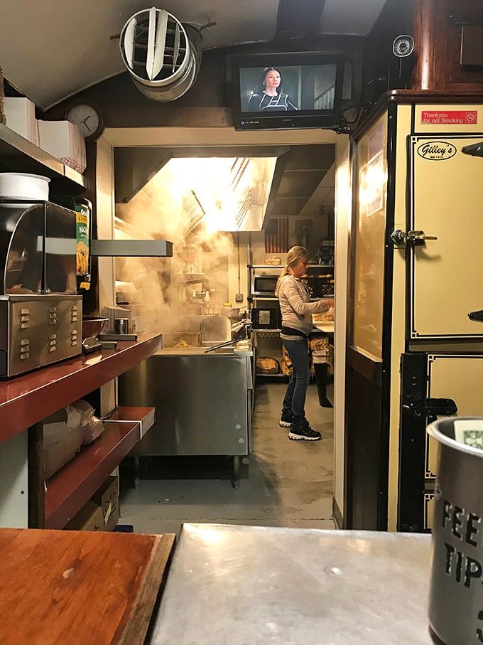 Behind the scenes, the kitchen's steam rises like culinary fog, where burgers and dogs are transformed from simple to sublime.