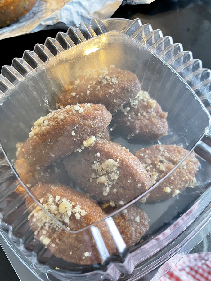 These honey-soaked melomakarona cookies look innocent enough, until you realize you've somehow eaten six while "just thinking about dessert."