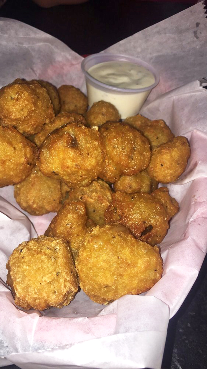 Mushrooms fried to golden perfection, like little umami bombs waiting to detonate on your taste buds. The dipping sauce is just showing off.