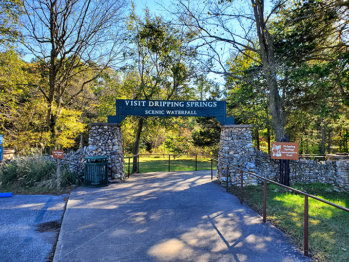 The entrance sign promises "Scenic Waterfall" with the same understatement as calling the Grand Canyon "a pretty big hole."