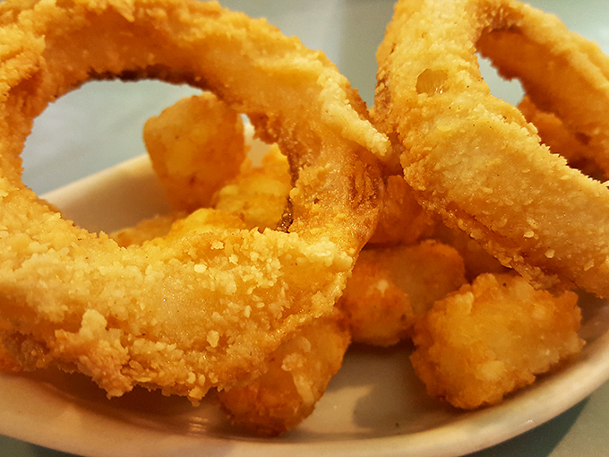Onion rings so perfectly golden and crisp, they make you wonder why fancy restaurants even bother with appetizers costing five times as much.