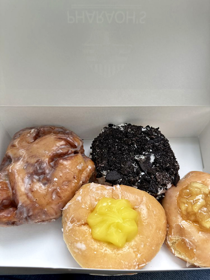 This quartet of donuts demonstrates why decisions are hard: Oreo crumble, apple fritter, and twin lemon-filled contenders all vying for your affection.