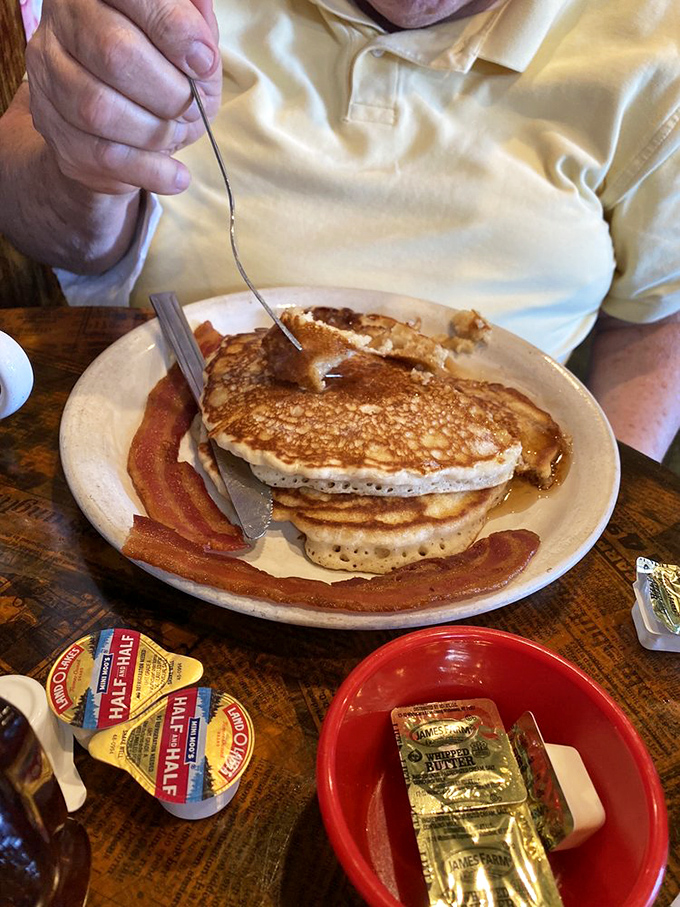 These pancakes with their perfect golden-brown exterior are the breakfast equivalent of winning the lottery while bacon cheers from the sidelines.