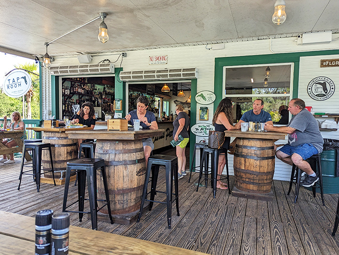 The outdoor bar area proves that barrel tables and good conversation are the perfect pairing for fresh seafood and cold drinks.