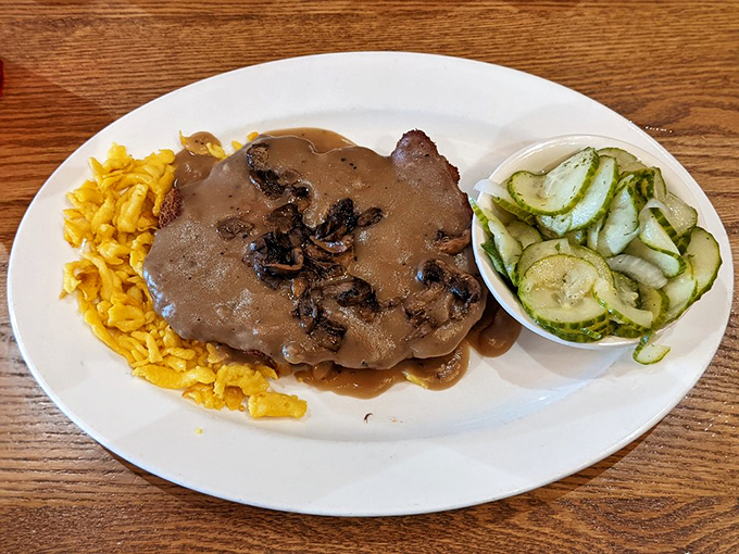 The J&auml;gerschnitzel doesn't merely sit on the plate&mdash;it commands it, with mushroom gravy that should be bottled and sold as liquid happiness.