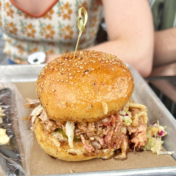 A pulled pork sandwich so perfectly stacked it deserves its own Manhattan apartment&mdash;at least it's found a good home in your hands.