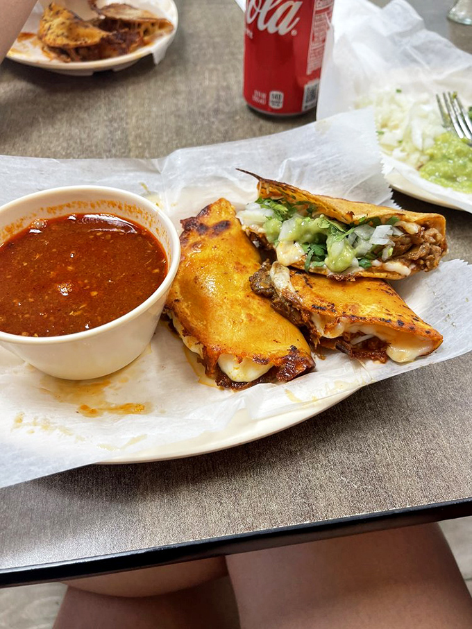 Quesabirria tacos that combine the gooey comfort of grilled cheese with the sophisticated depth of slow-cooked meat&mdash;like culinary poetry on a plate.