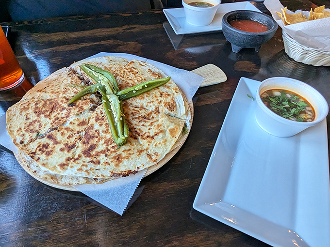 A quesadilla so perfectly grilled it deserves its own spotlight. Those charred edges are where the magic happens&mdash;crispy, cheesy perfection with roasted peppers standing guard.