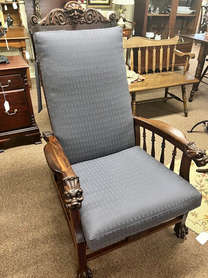 This distinguished chair with carved griffins on the armrests isn't just seating &ndash; it's practically antique royalty waiting for its next court appointment.