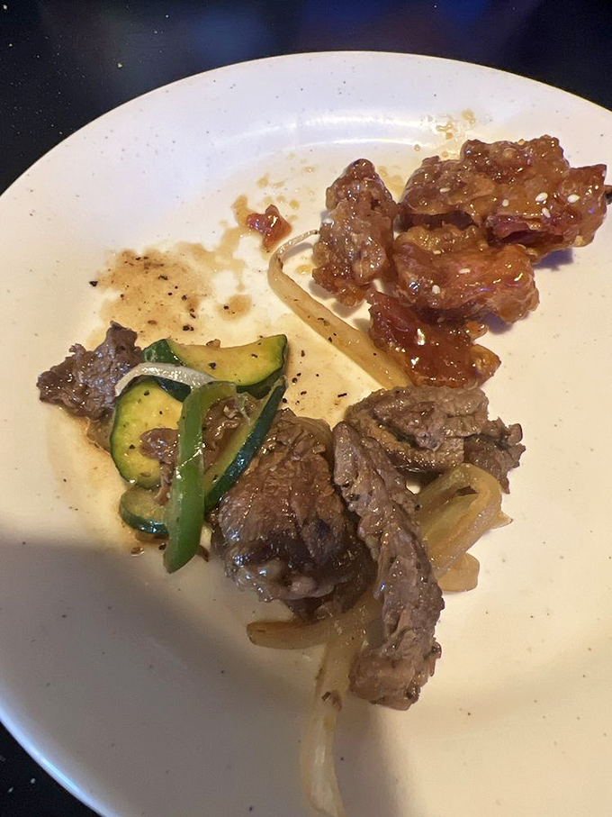 Beef and orange chicken sharing a plate like old friends catching up. Why choose when you can have both?