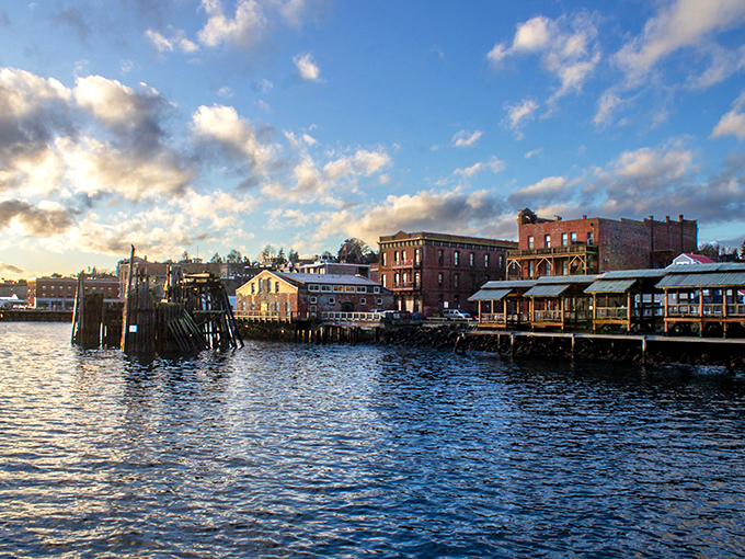 Waterfront buildings perch on pilings like eager theatergoers, securing front-row seats to the daily drama of tides, boats, and spectacular sunsets.