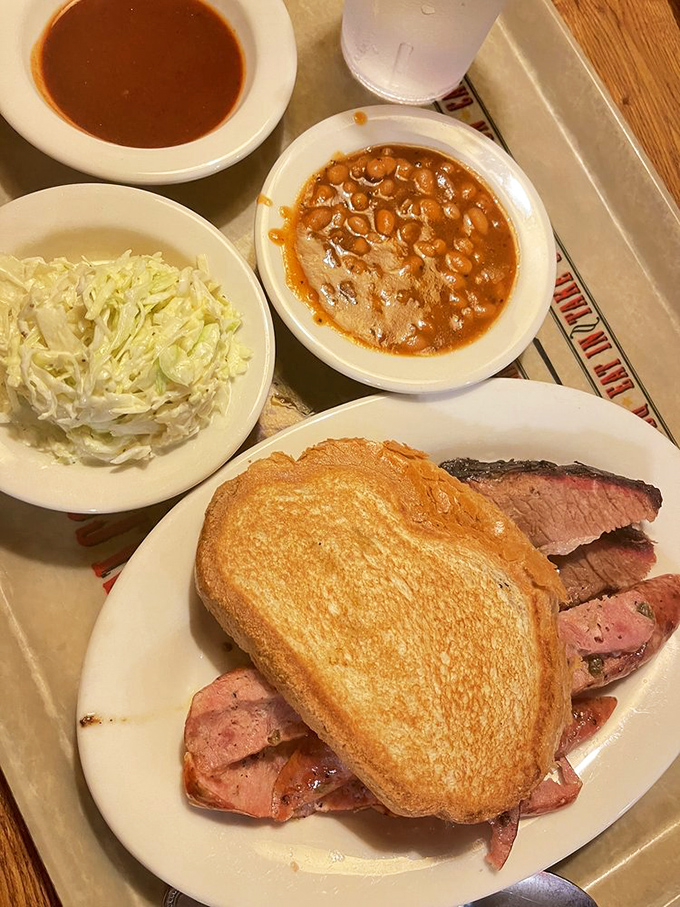 The holy trinity of barbecue: perfectly toasted bread, tender meat, and sides that don't know they're supposed to be supporting actors.