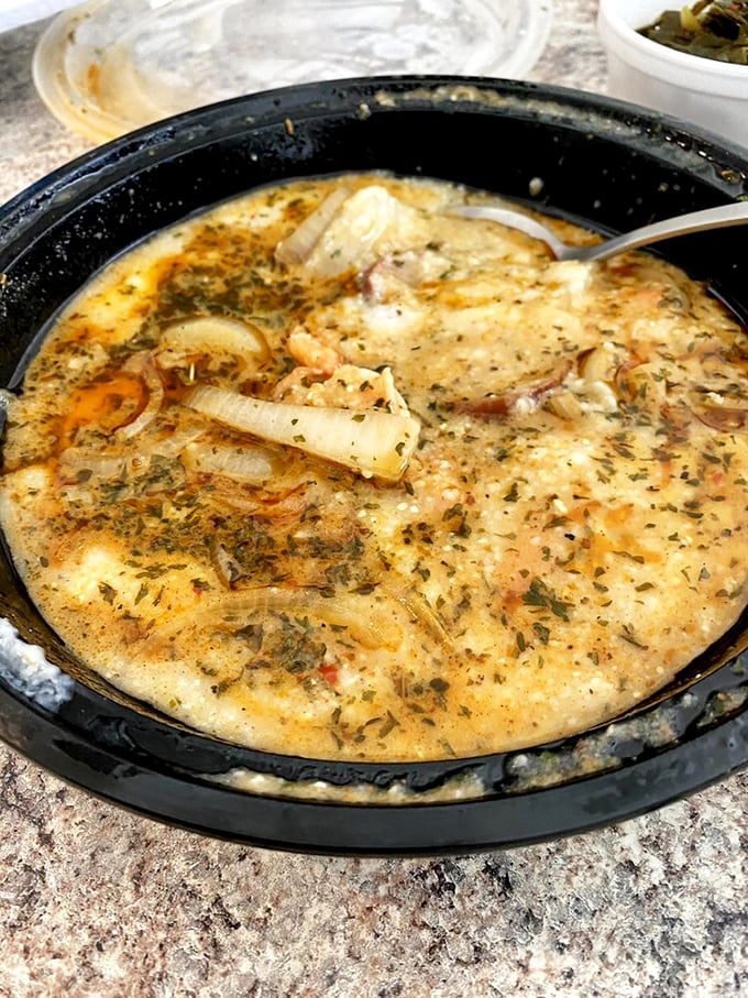 A bowl of shrimp and grits that would make a New Orleans chef tip their hat in respectful acknowledgment of serious Southern cooking skills.