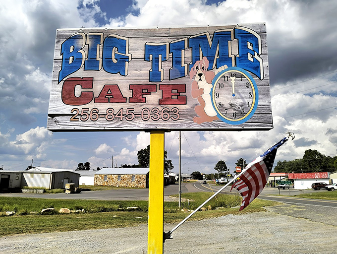 The roadside sign stands like a beacon of hope for hungry travelers&mdash;follow the dog and clock to burger paradise.
