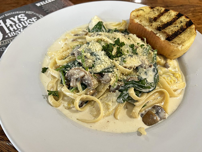 Pasta that doesn't need a passport to Italy. This creamy spinach and mushroom fettuccine with grilled bread is Kansas comfort with Italian flair.