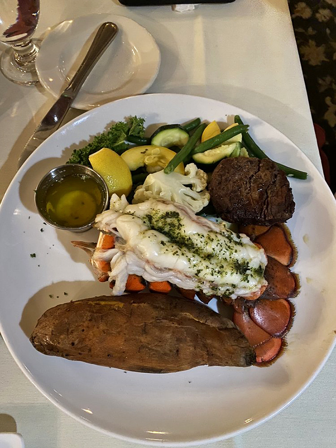 The surf meets turf in a plate that screams "celebration." That lobster tail isn't just food—it's a statement piece.