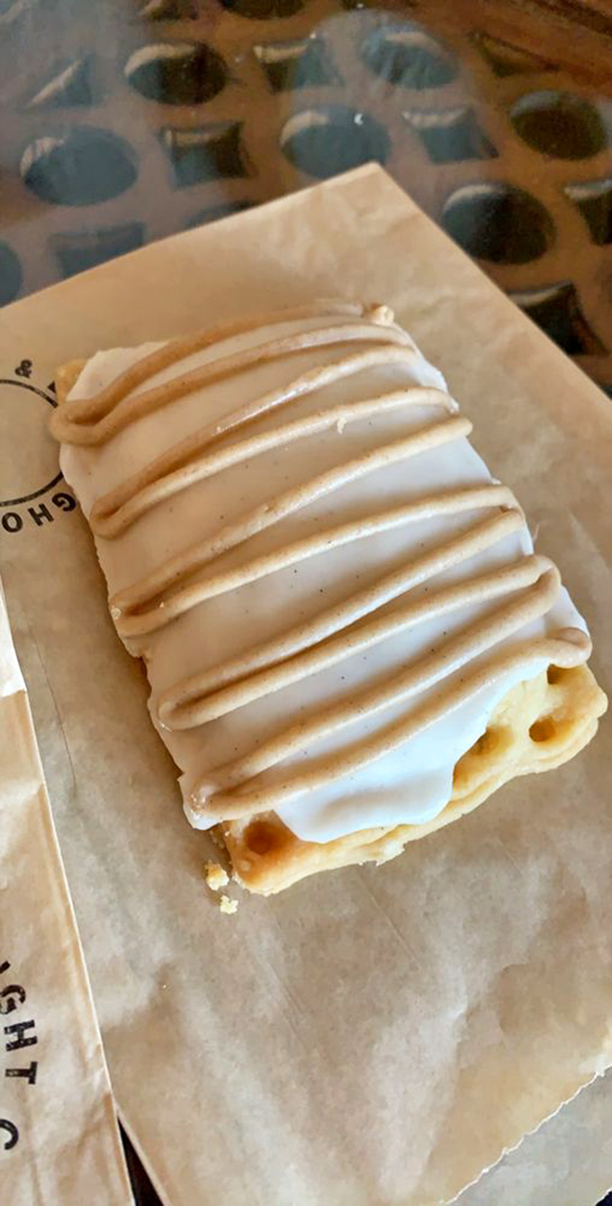 This pastry's frosting stripes are so perfectly aligned they could make a military sergeant weep with pride. Resistance is absolutely futile.