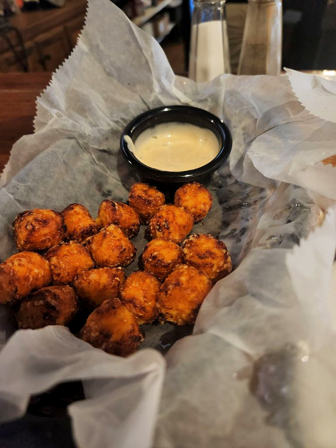 Perfectly golden tater tots that crunch like childhood memories. The dipping sauce isn't optional&mdash;it's an essential part of the experience.
