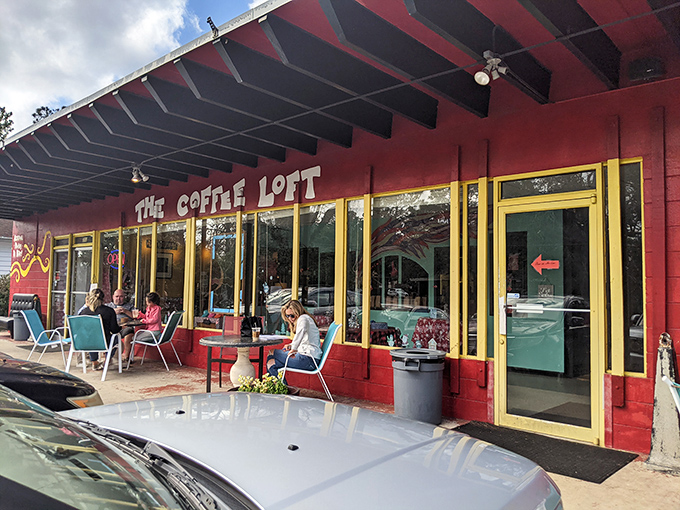 The Coffee Loft's vibrant red exterior promises what every morning needs: caffeination with character and patio conversations that might just change your day.