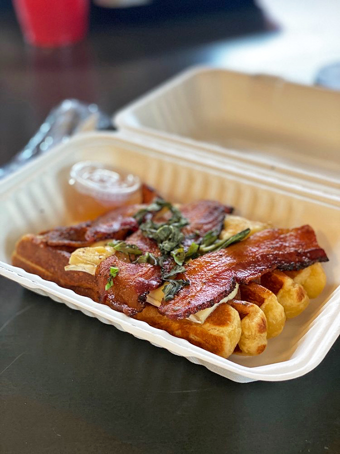 The Triple B Waffle: where bacon meets basil in a breakfast rendezvous that will make you forget every sad frozen waffle you've ever eaten.