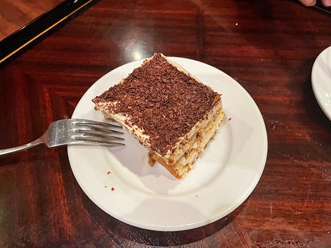 Tiramisu that's layered like a good mystery novel—each forkful revealing new depths of flavor while the chocolate shavings provide the perfect epilogue.