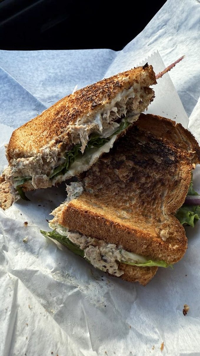 The humble tuna melt, elevated to art form. That golden-brown toast crackles just looking at it, while the filling remains the perfect creamy counterpoint.