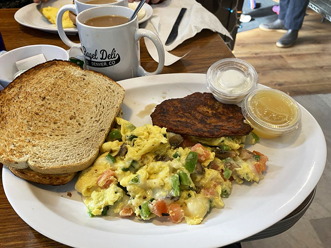Breakfast of champions! When scrambled eggs meet toast and a potato latke, it's not just a meal&mdash;it's morning poetry on a plate.