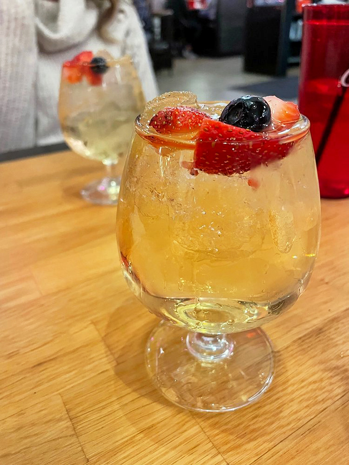 This white sangria isn't just a drink, it's a vacation in a glass – fruity, refreshing, and dangerously easy to enjoy while watching boats drift by.