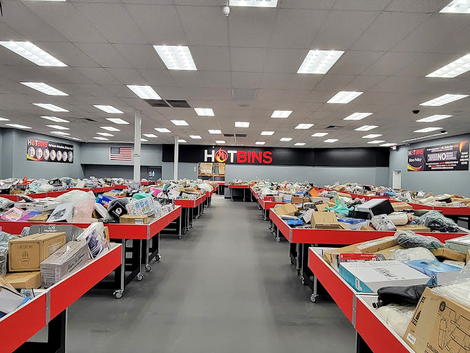 The perspective down a Hotbins aisle feels infinite. A retail version of those mirrors that reflect each other endlessly, except with more air fryers.