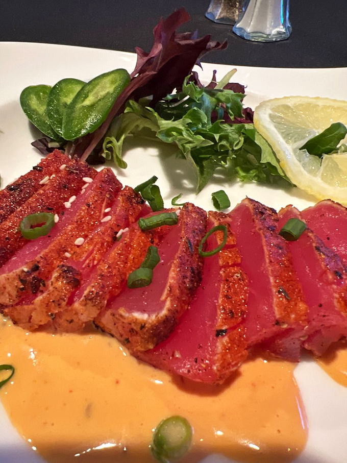 Seared tuna that's dressed better than most people at the theater. The sauce is practically auditioning for its own cooking show.