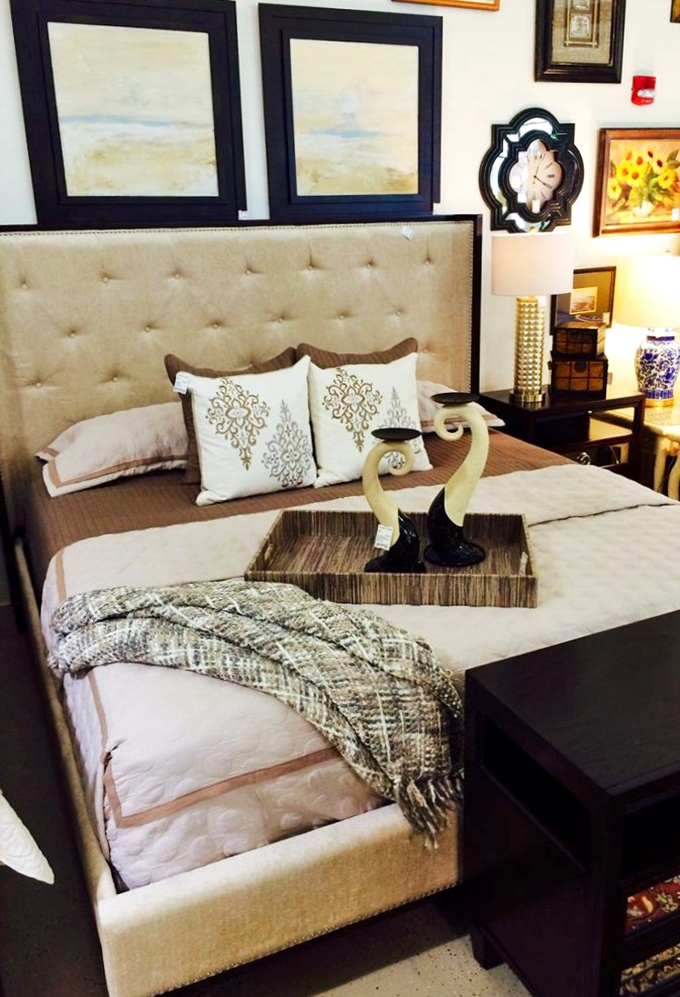 A bedroom vignette that promises the kind of sleep quality people pay subscription fees for—tufted headboard included, dreams sold separately.